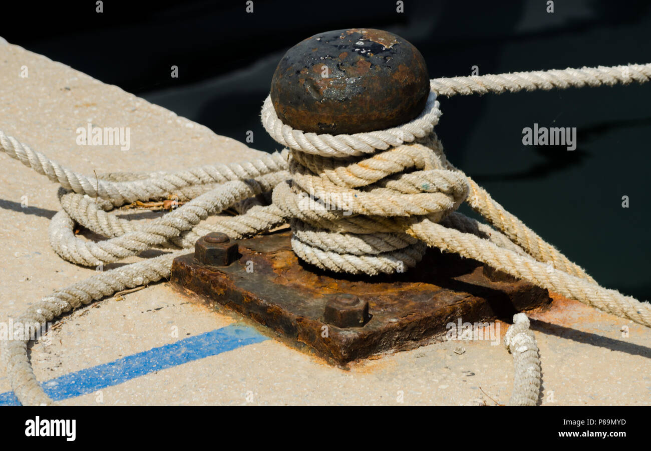 mooring post on the waterfront in a small marina, element for mooring ...
