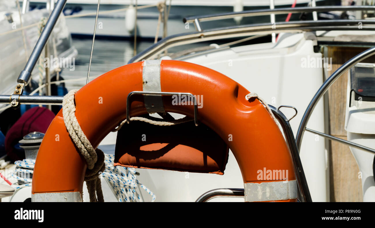 Orange lifebuoy on the side of the boat, an essential tool life-saving ...