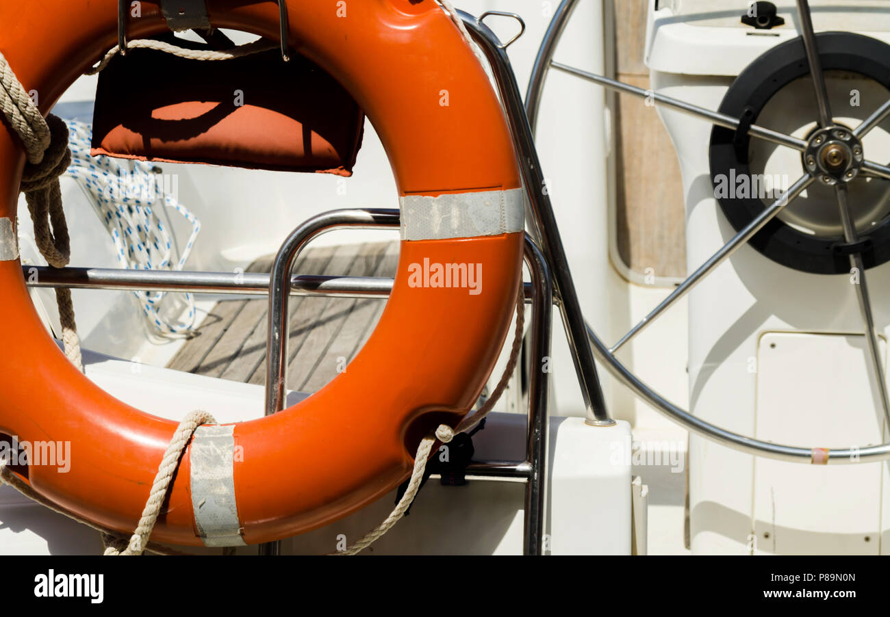 Orange lifebuoy on the side of the boat, an essential tool life-saving ...