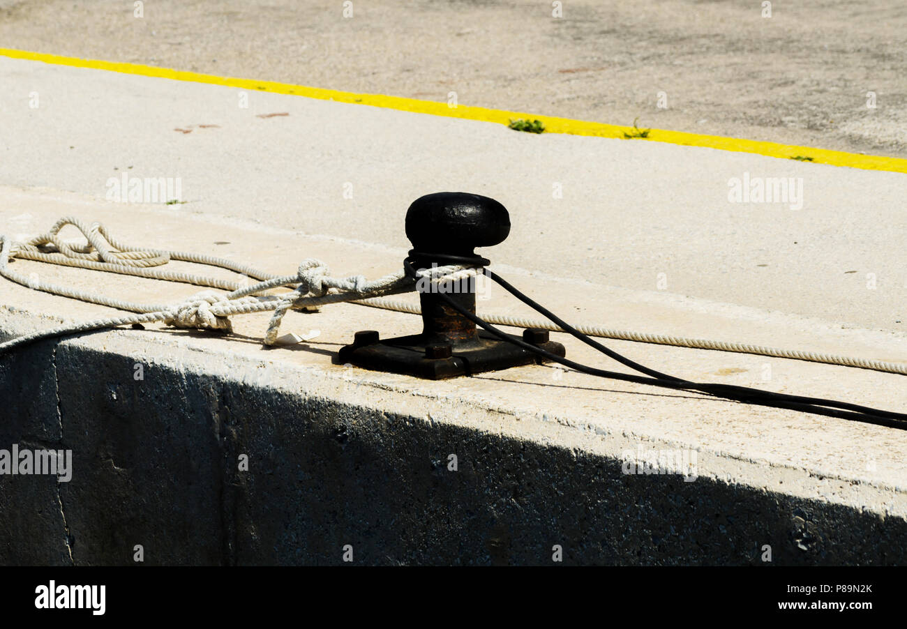 mooring post on the waterfront in a small marina, element for mooring ...