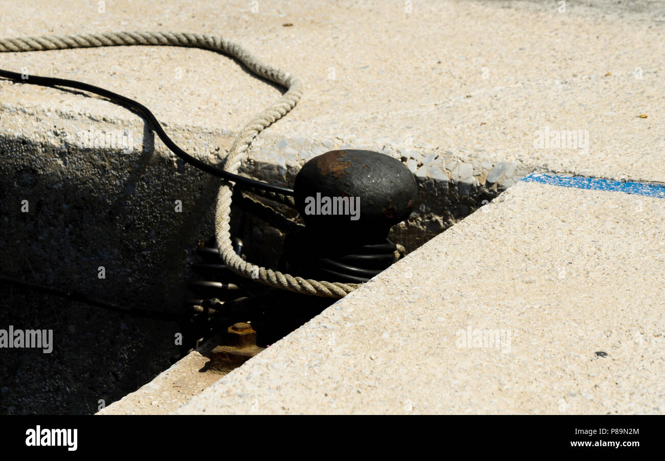 mooring post on the waterfront in a small marina, element for mooring ...