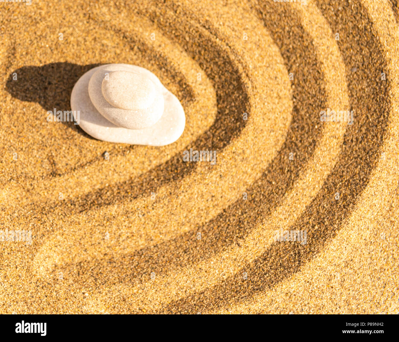 zen meditation stone in sand, concept for purity harmony and ...