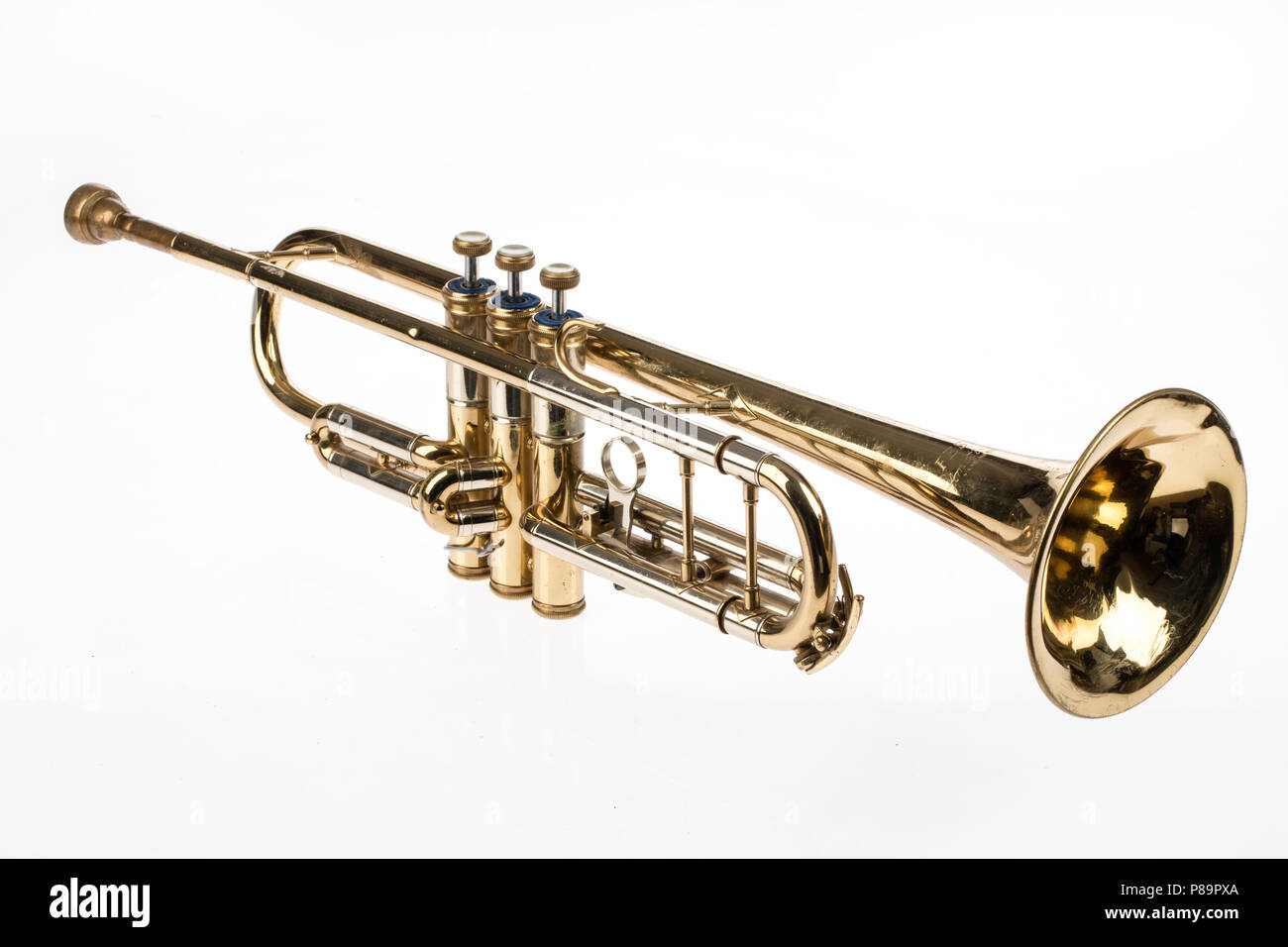 Old trumpet on an isolated studio background Stock Photo - Alamy