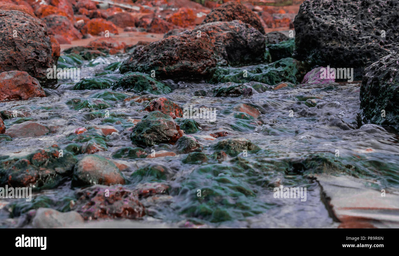 Fast flowing downstream current of shallow river of fresh water ...