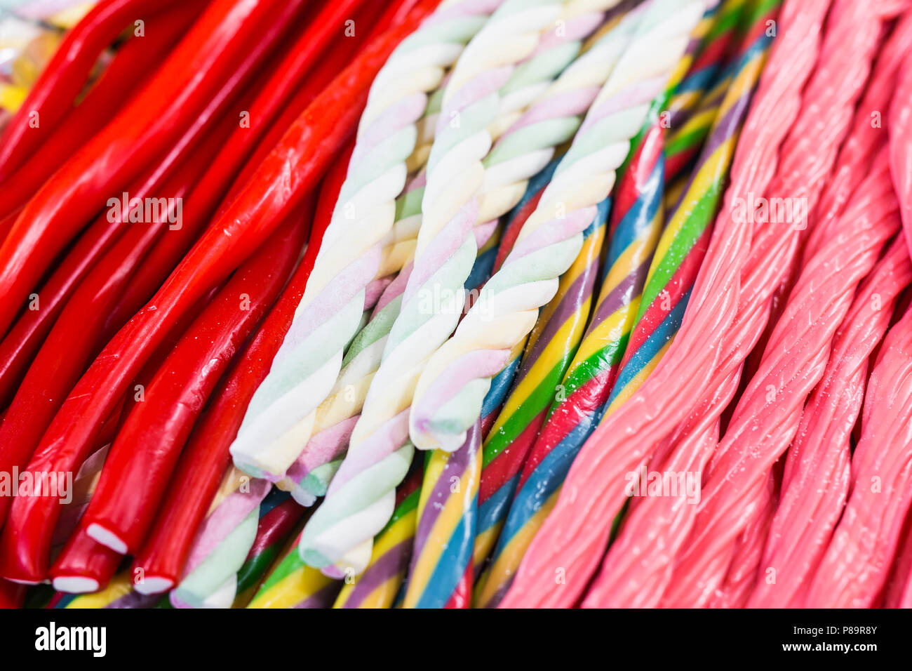 Wonderful candy sticks in any color and appearance Stock Photo - Alamy