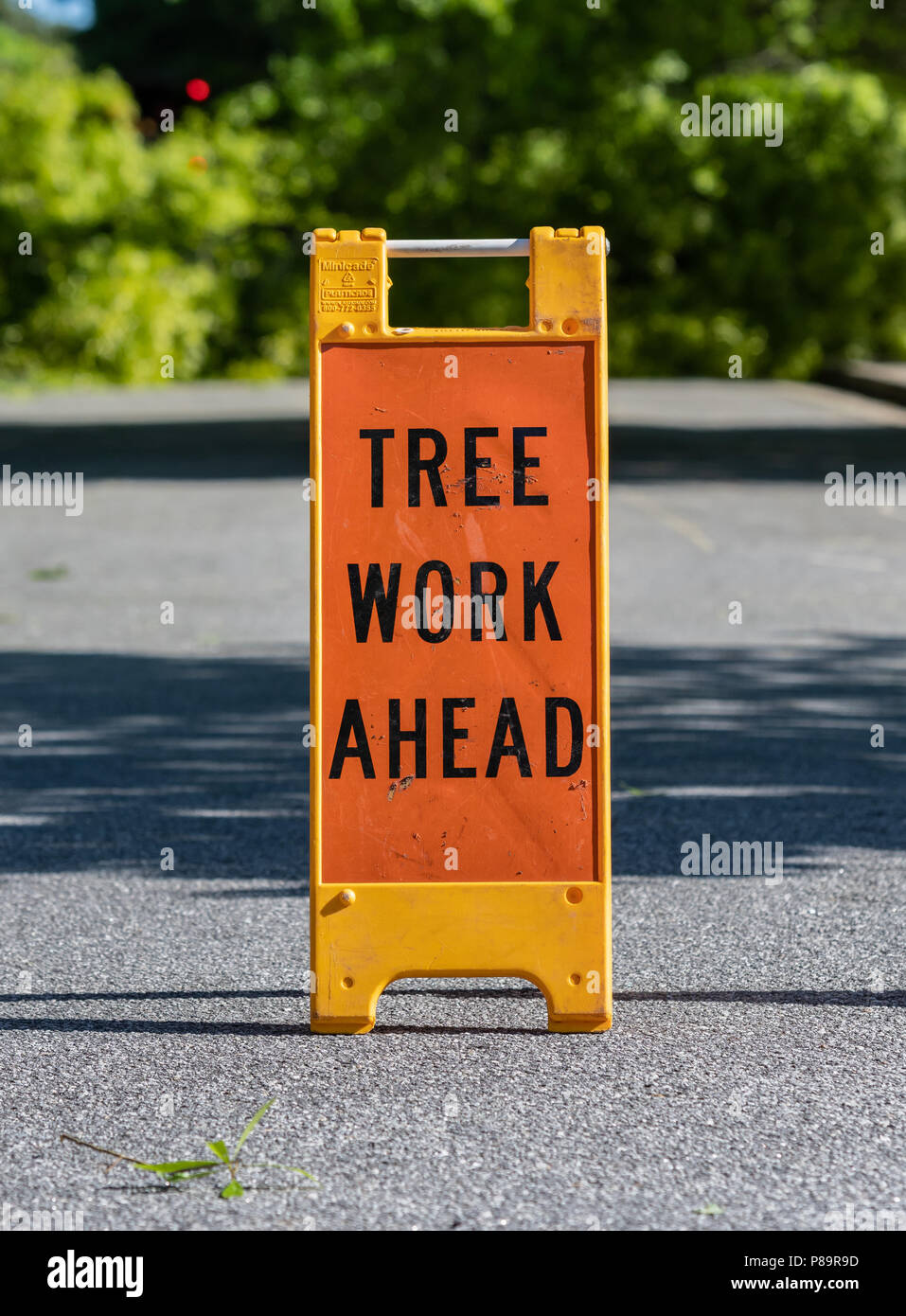 Tree Work Ahead Folding Sign on suburban street Stock Photo - Alamy