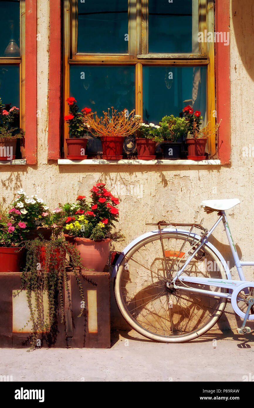 an image of parked bicycle front of window Stock Photo - Alamy