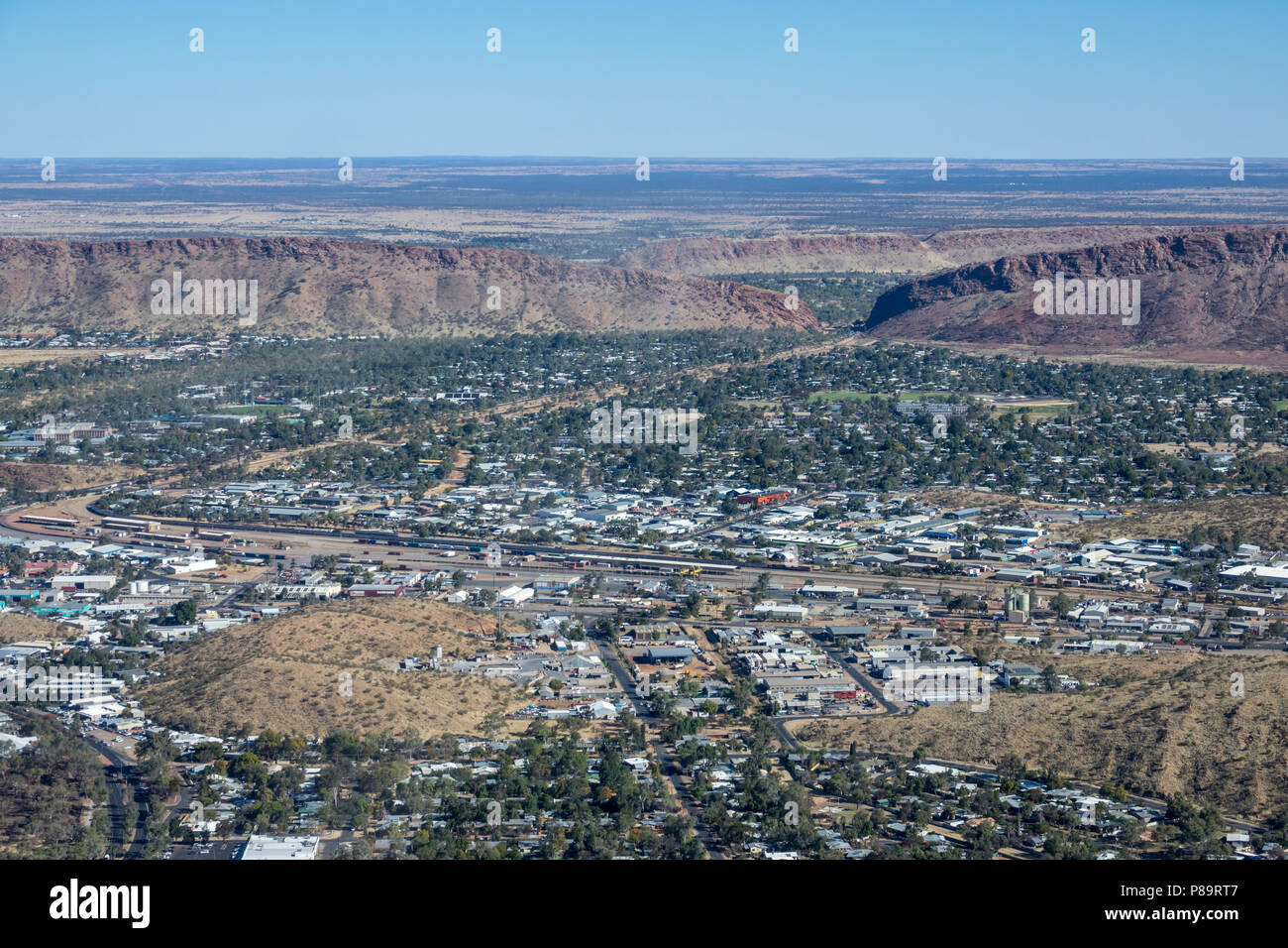 Aerial view over Alice Springs with The Ghan at Alice Springs station ...