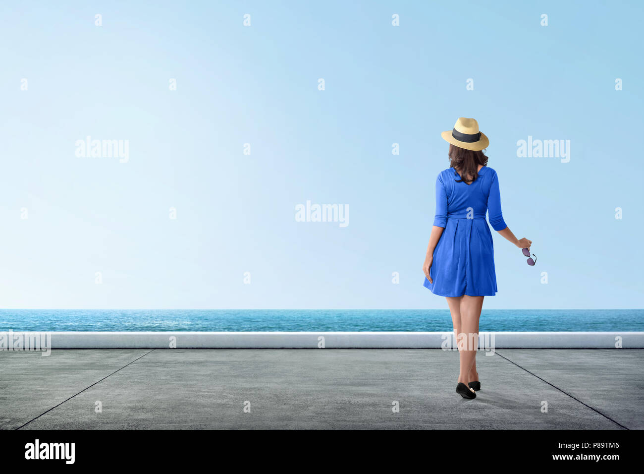 Back view asian tourist woman looking at ocean view from pier Stock ...
