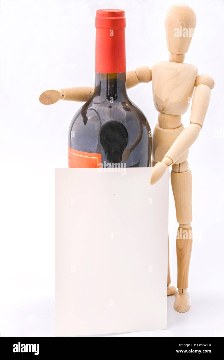 Wooden dummy presents red wine in bottle with blank message card Stock ...