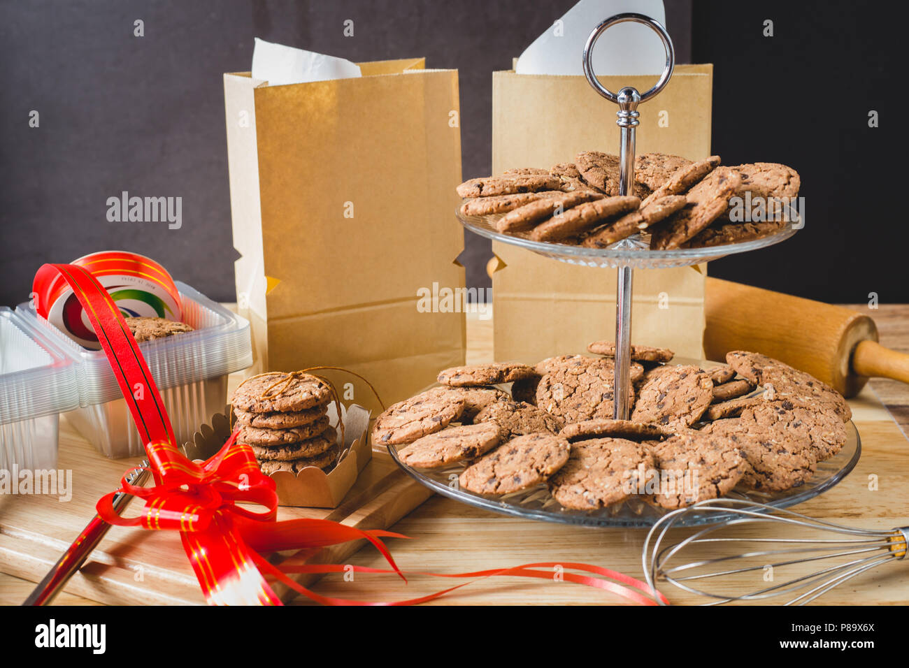 Freshly baked chocolate chip cookies with packaging Stock Photo - Alamy