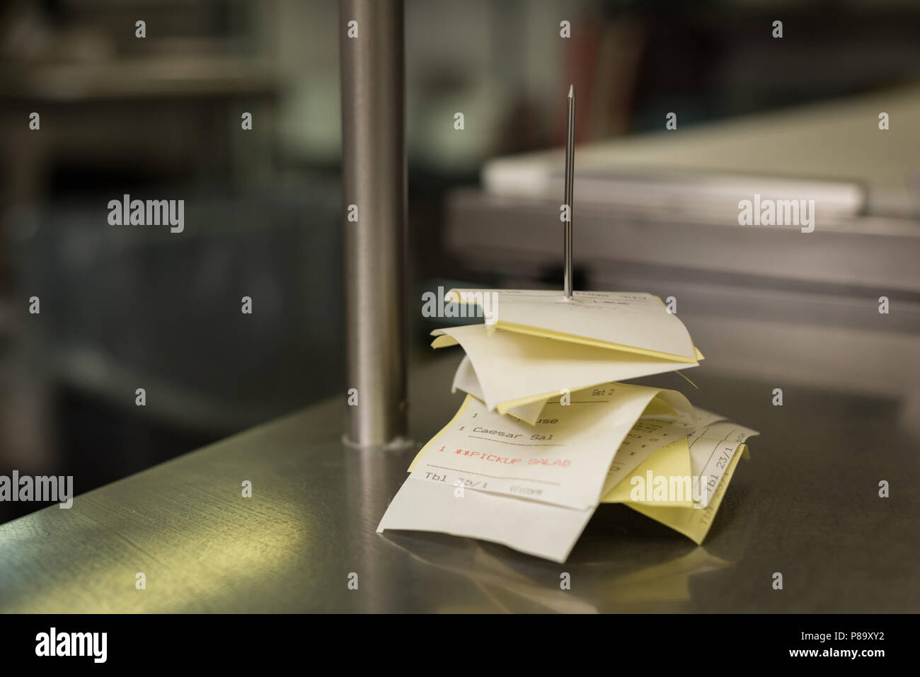Bill on bill pin stand in kitchen Stock Photo - Alamy