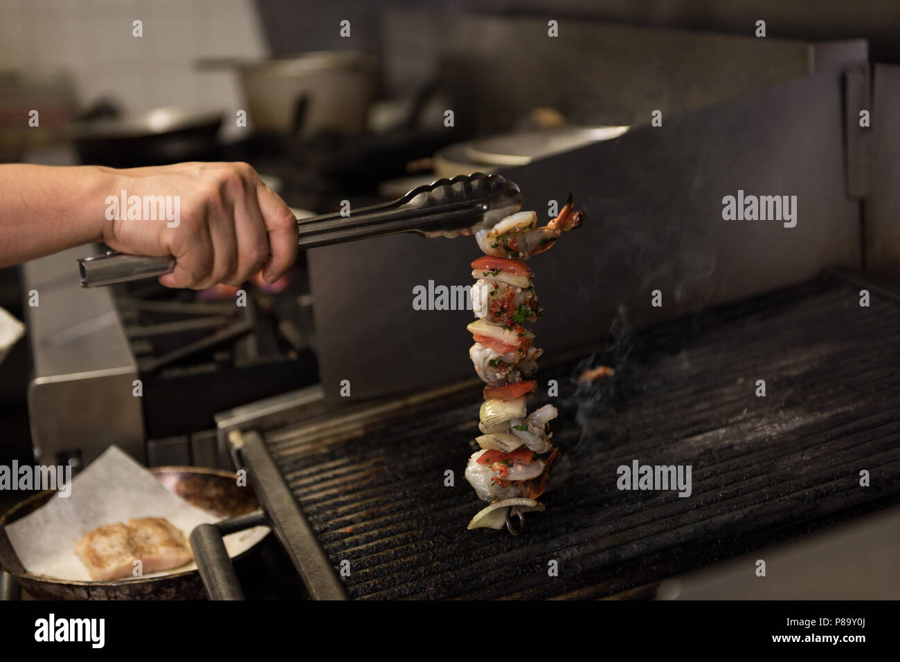 Male chef preparing paneer sticks in kitchen Stock Photo - Alamy