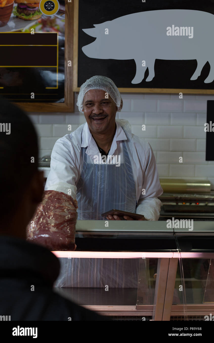Butcher selling meat hi-res stock photography and images - Alamy