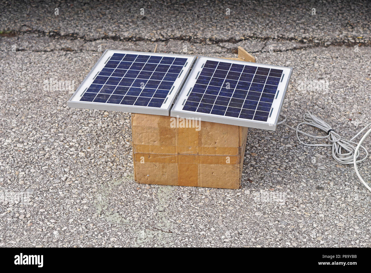 Double solar panel cells at box outside Stock Photo - Alamy