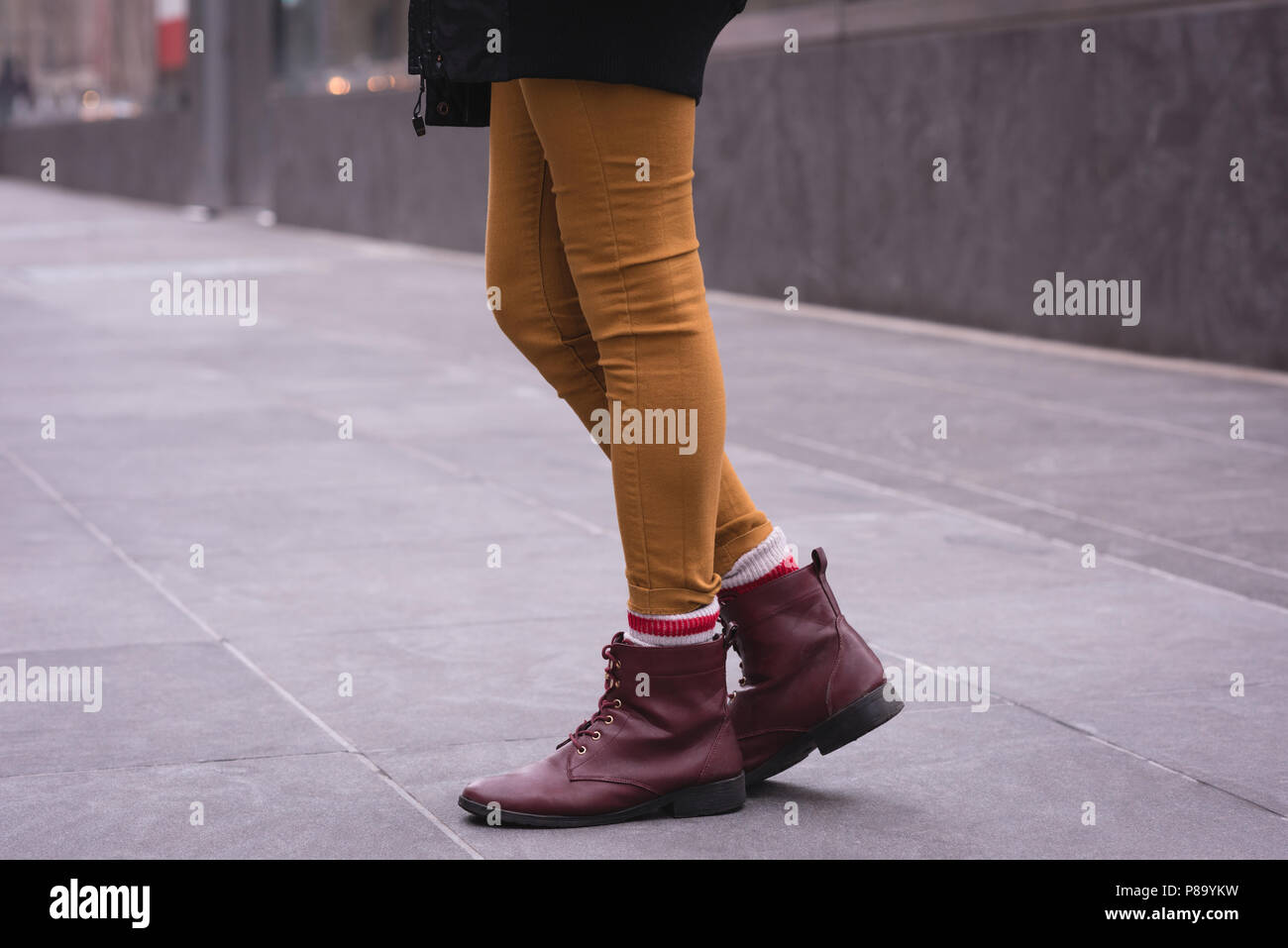 Woman standing on the street hi-res stock photography and images - Alamy