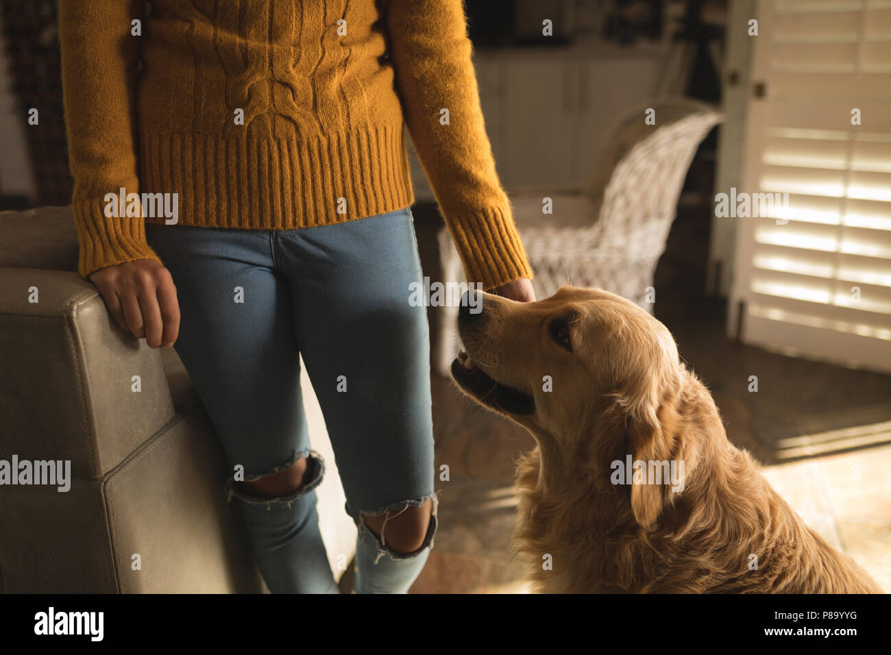 Girl standing with her dog hi-res stock photography and images - Alamy