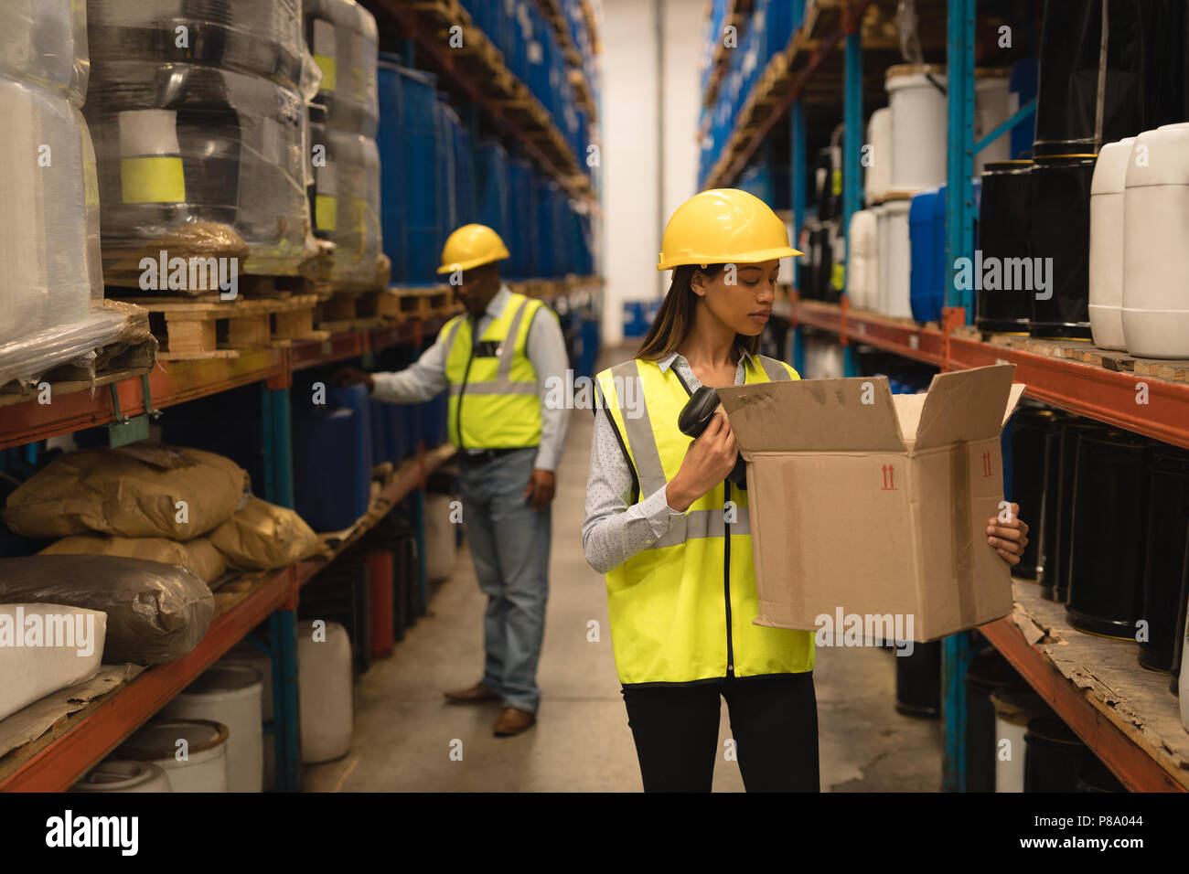 Female Staff checking stocks Stock Photo - Alamy