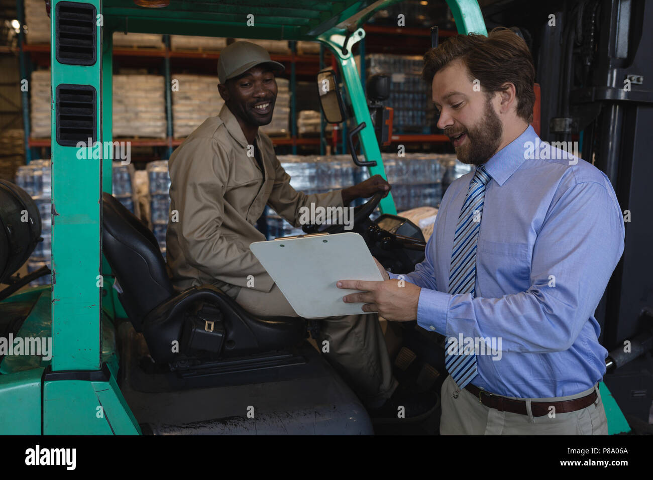 Warehouse interacting manager hi-res stock photography and images - Alamy