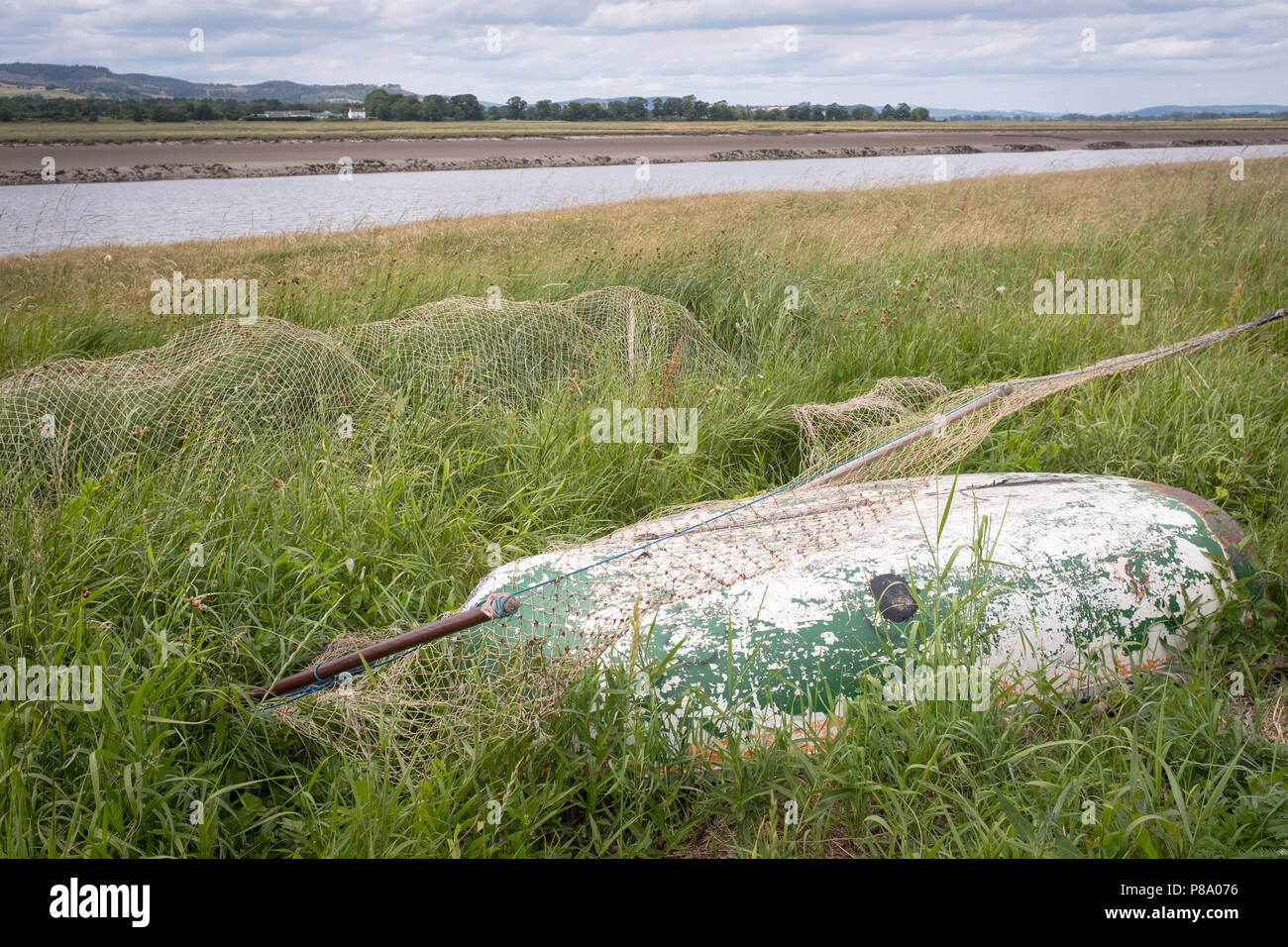 View across the River Nith at Glencaple, Scotland. Small upturned boat ...