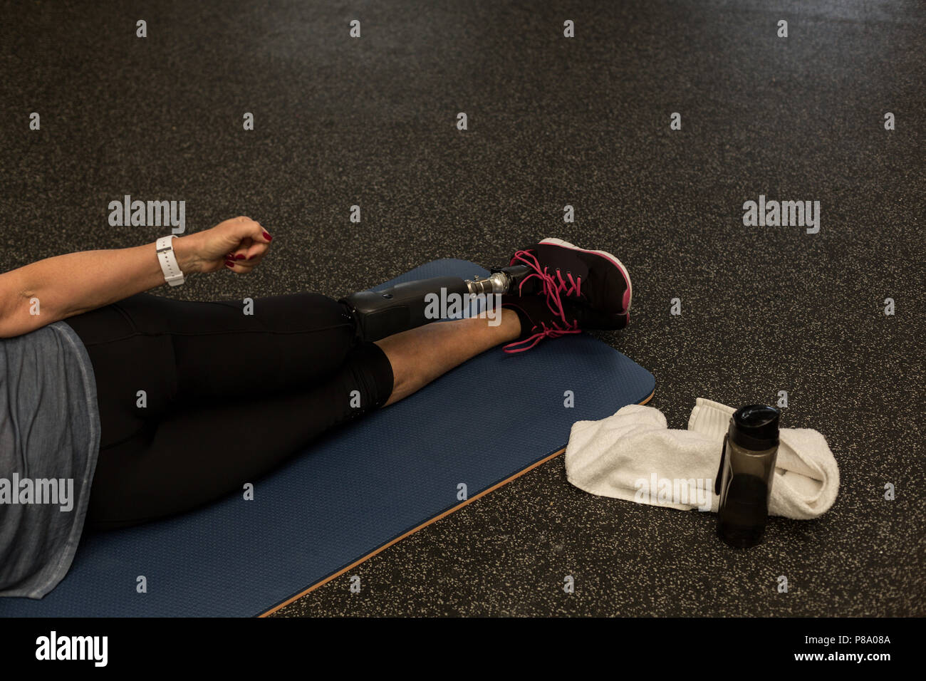 Disabled woman performing stretching exercise Stock Photo - Alamy