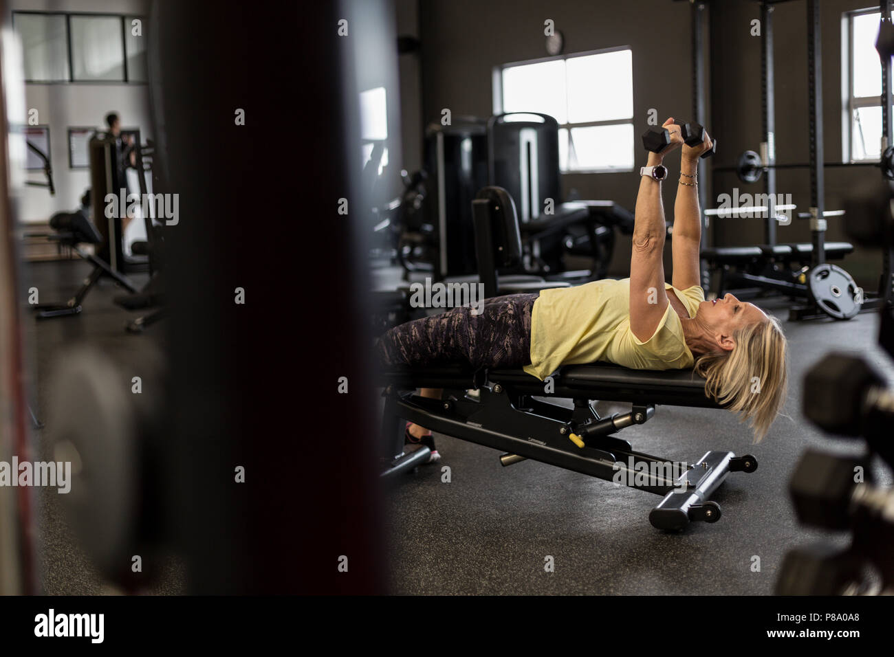 Woman exercising on machine hi-res stock photography and images - Alamy