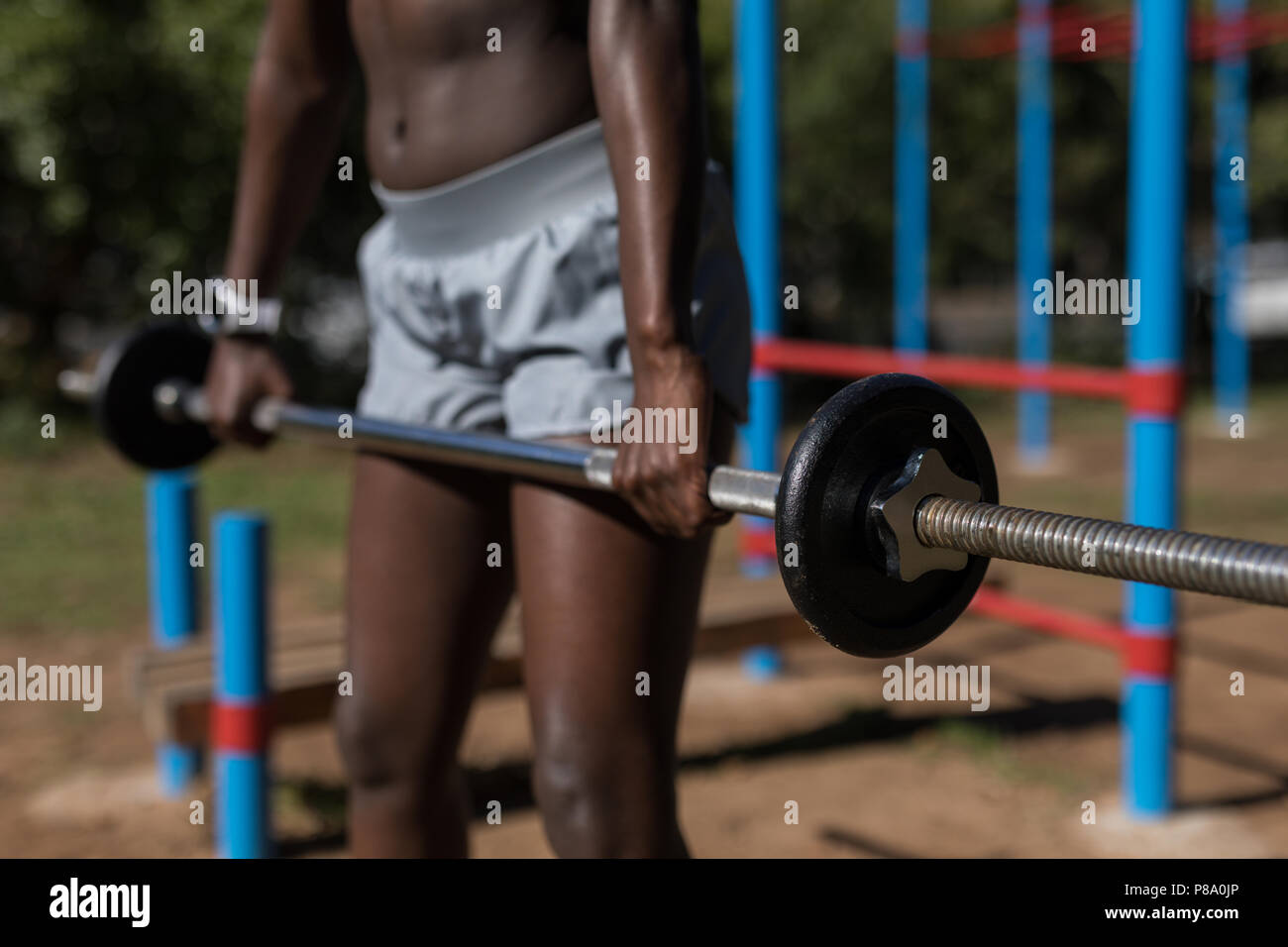 Female athlete lifting barbell Stock Photo - Alamy