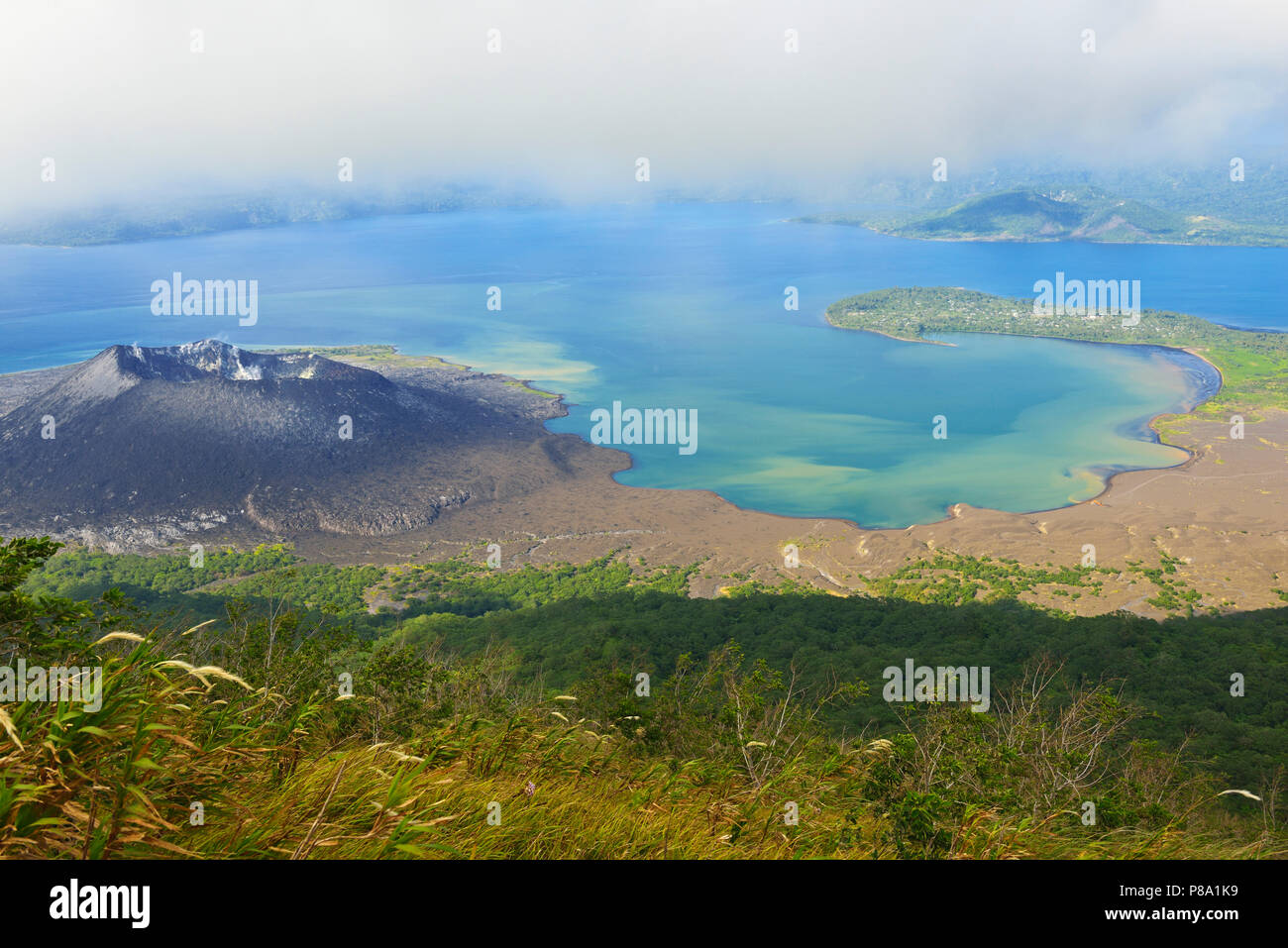 Ascent to Mount Kobui with view into the crater of the volcano Tavurvur ...