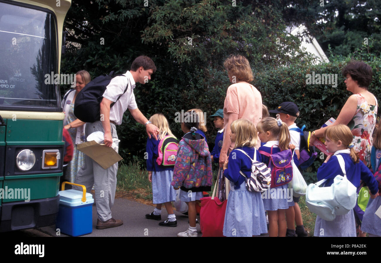 primary school children boarding bus to go on school trip Stock Photo ...