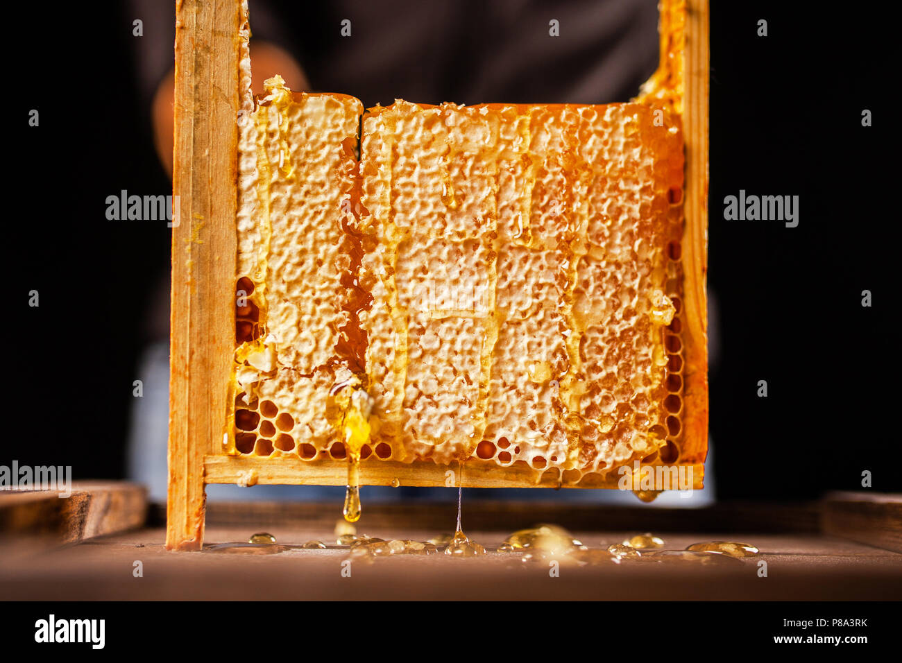 Honeycomb in a wooden frame Stock Photo - Alamy