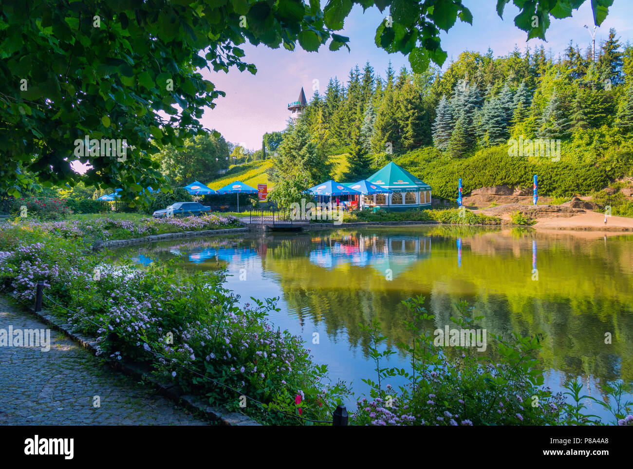 A recreation area under a tent near an artificially created lake in a ...