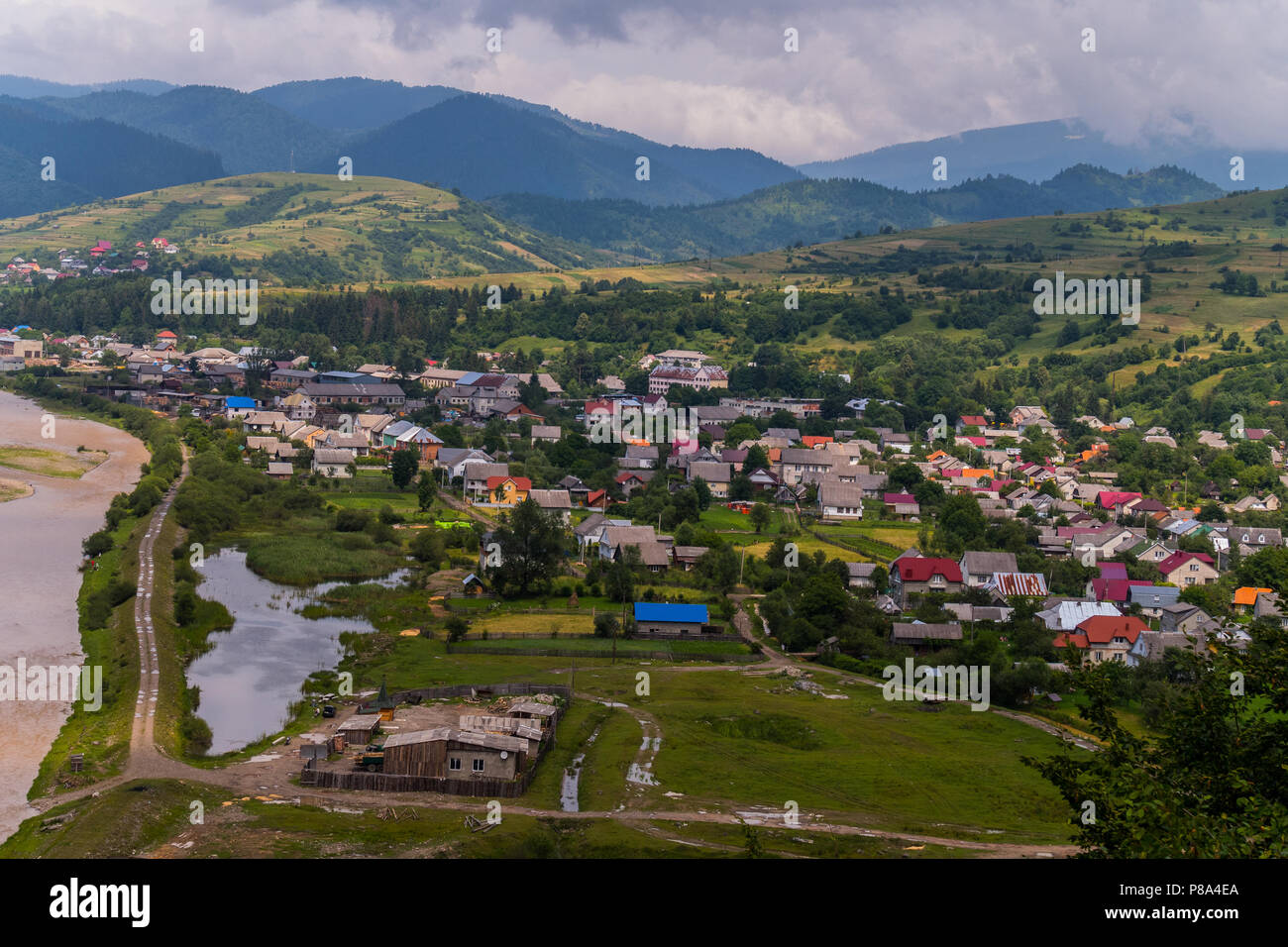 Village village with small houses is located in the shadow of a large ...