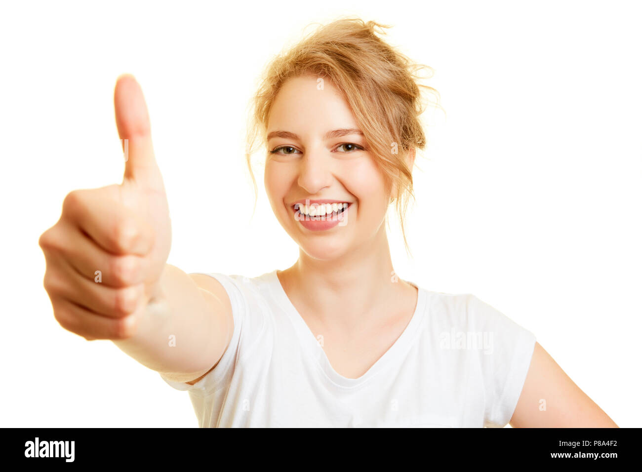 Young blond woman holds her thumbs up as a token of rating Stock Photo ...