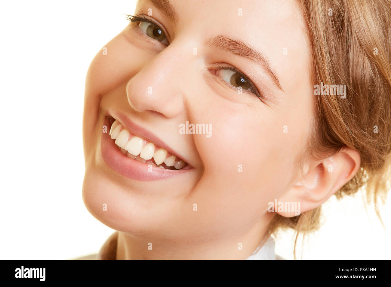 Young smiling woman looks happy into the camera Stock Photo - Alamy