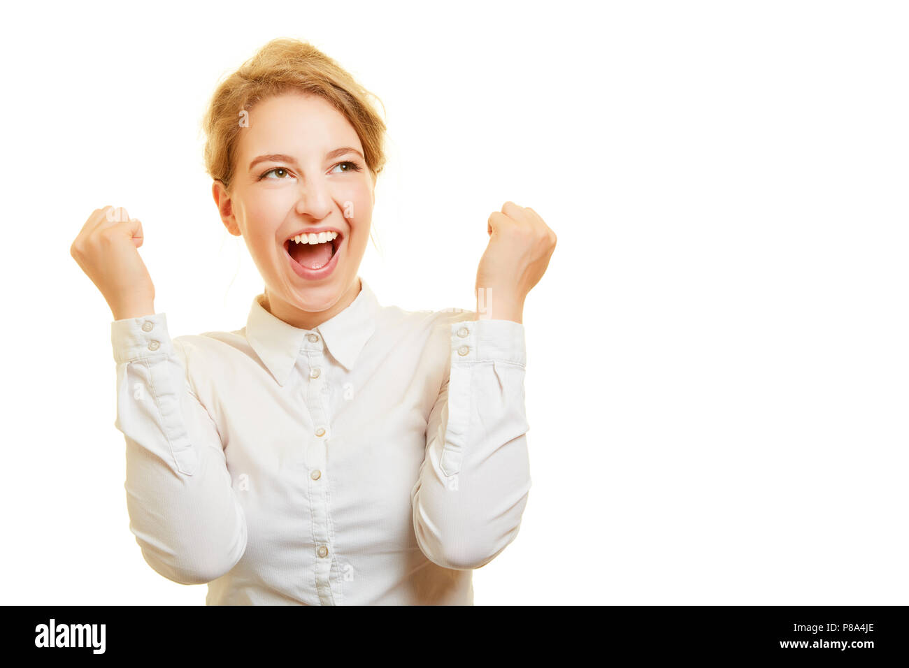 Young woman as winner and winner cheers and screams for joy Stock Photo ...