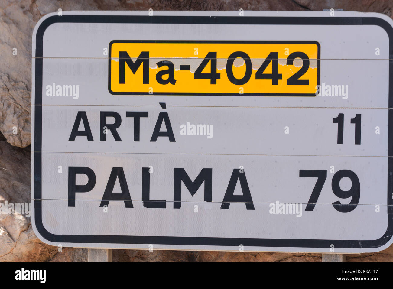 Road sign in Spain. Give the distance to the places Arta and Palma ...