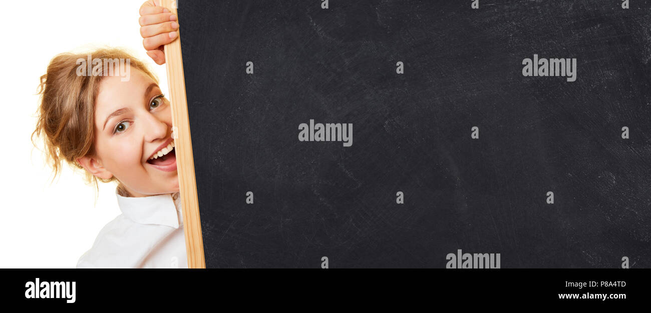 Laughing young woman behind a blank chalkboard background Stock Photo ...