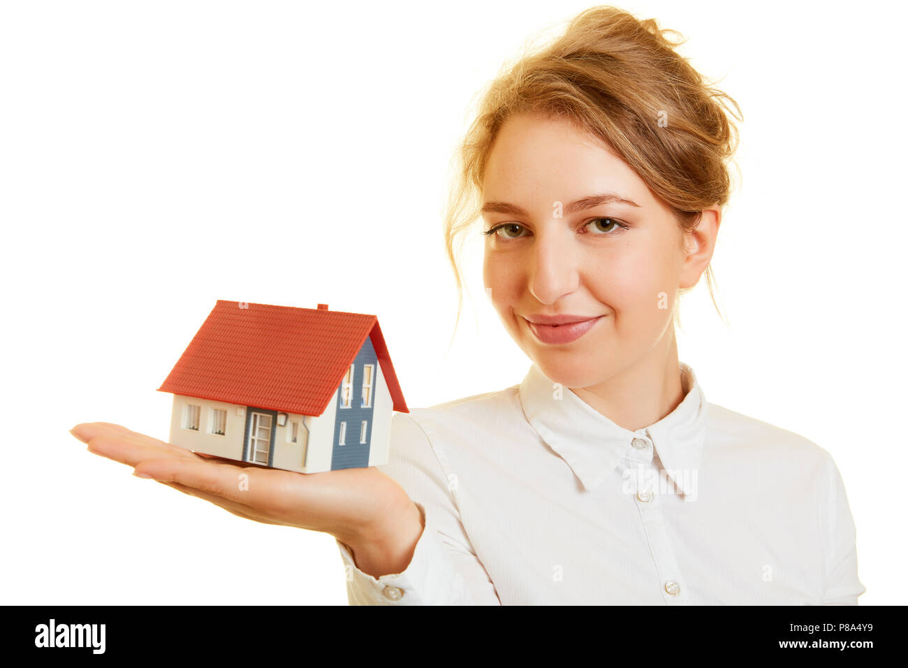 Woman carries family home on her hand as real estate insurance concept ...