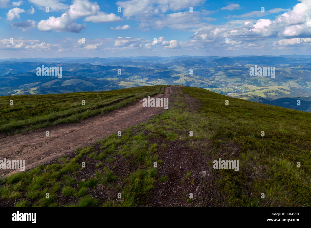 The path leading to the edge of the green mountain, from which a ...
