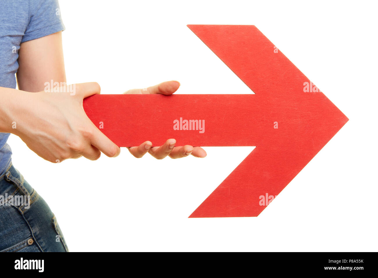 Two female hands hold a red arrow as a direction concept Stock Photo ...
