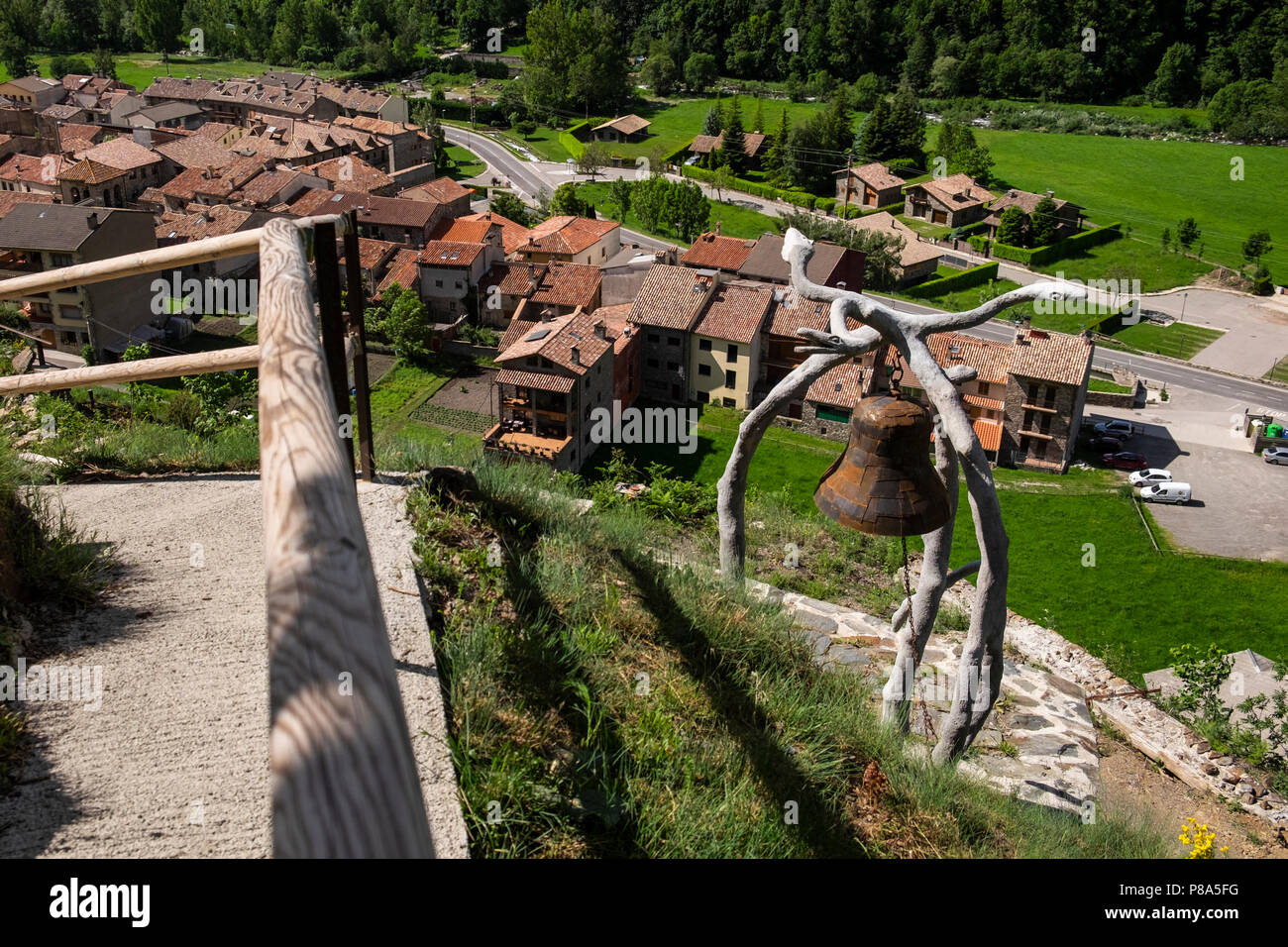 Stone and iron sculpture with snakes and a bell at the Mirador de Drac ...