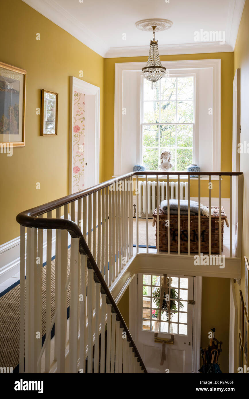 Glass chandelier in hallway landing of Regency home Stock Photo - Alamy