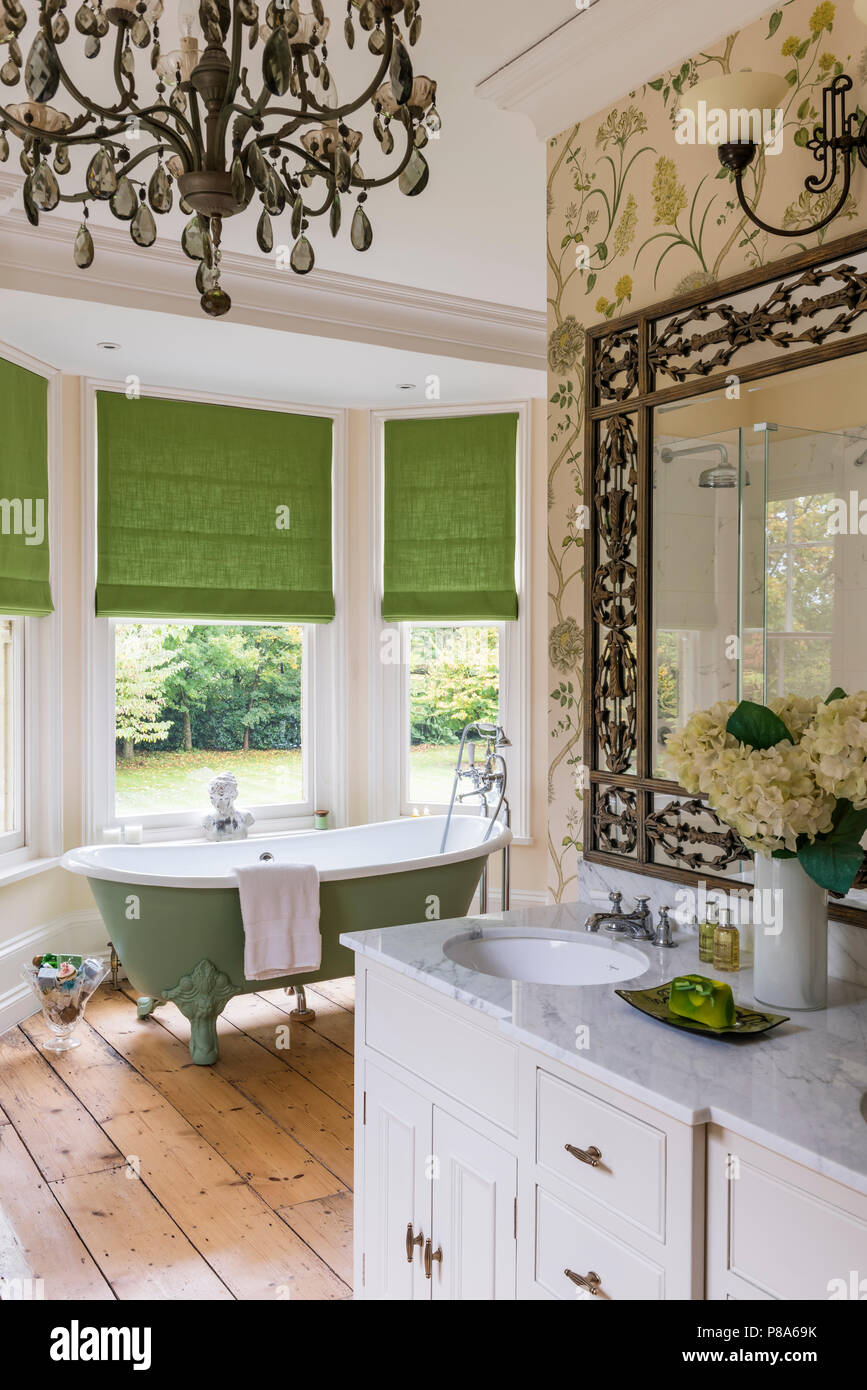 Freestanding bath at bay window in Regency bathroom with green blinds ...