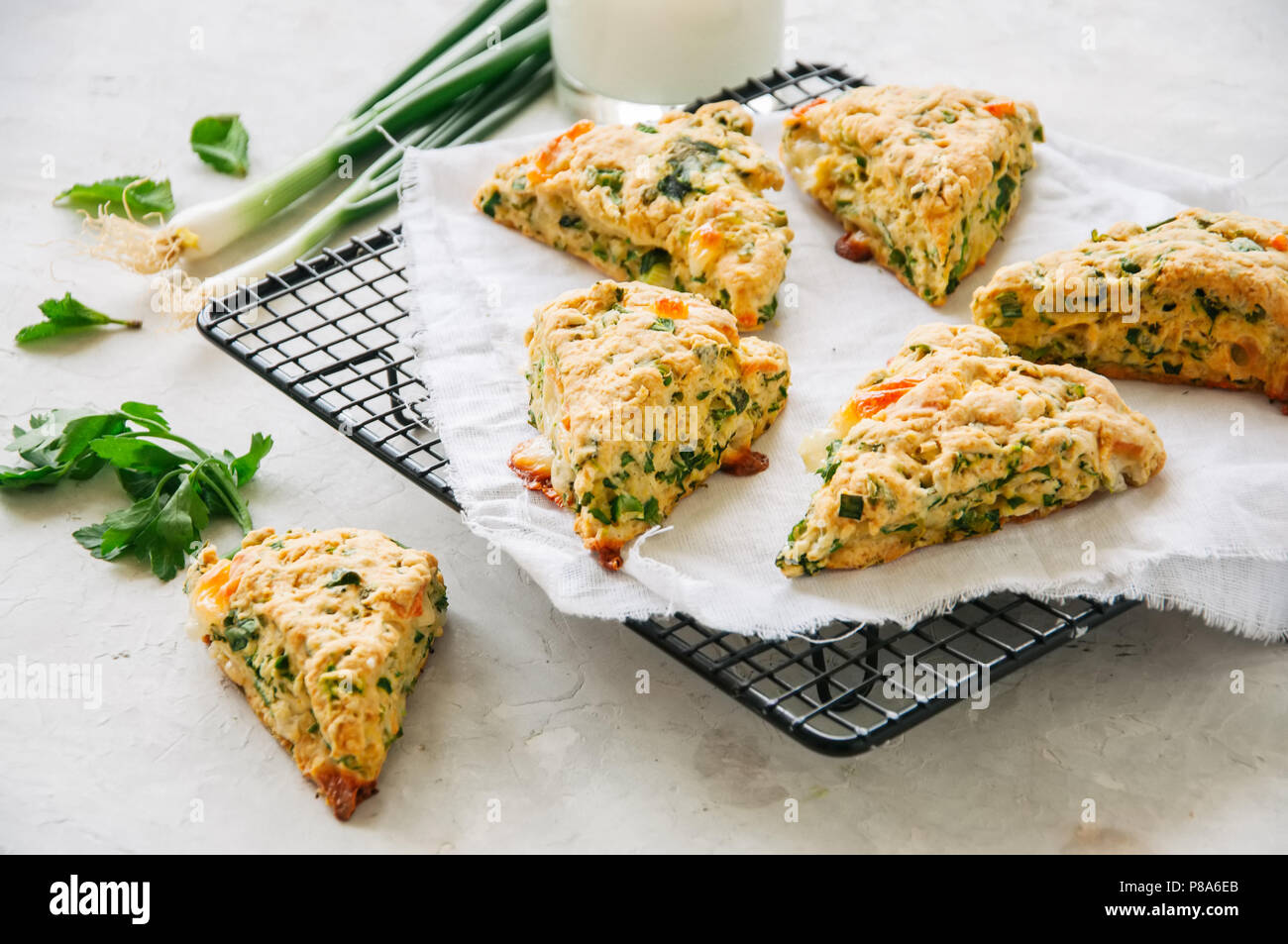 Savory scones with feta mozzarella and green herbs on a wire rack Stock ...