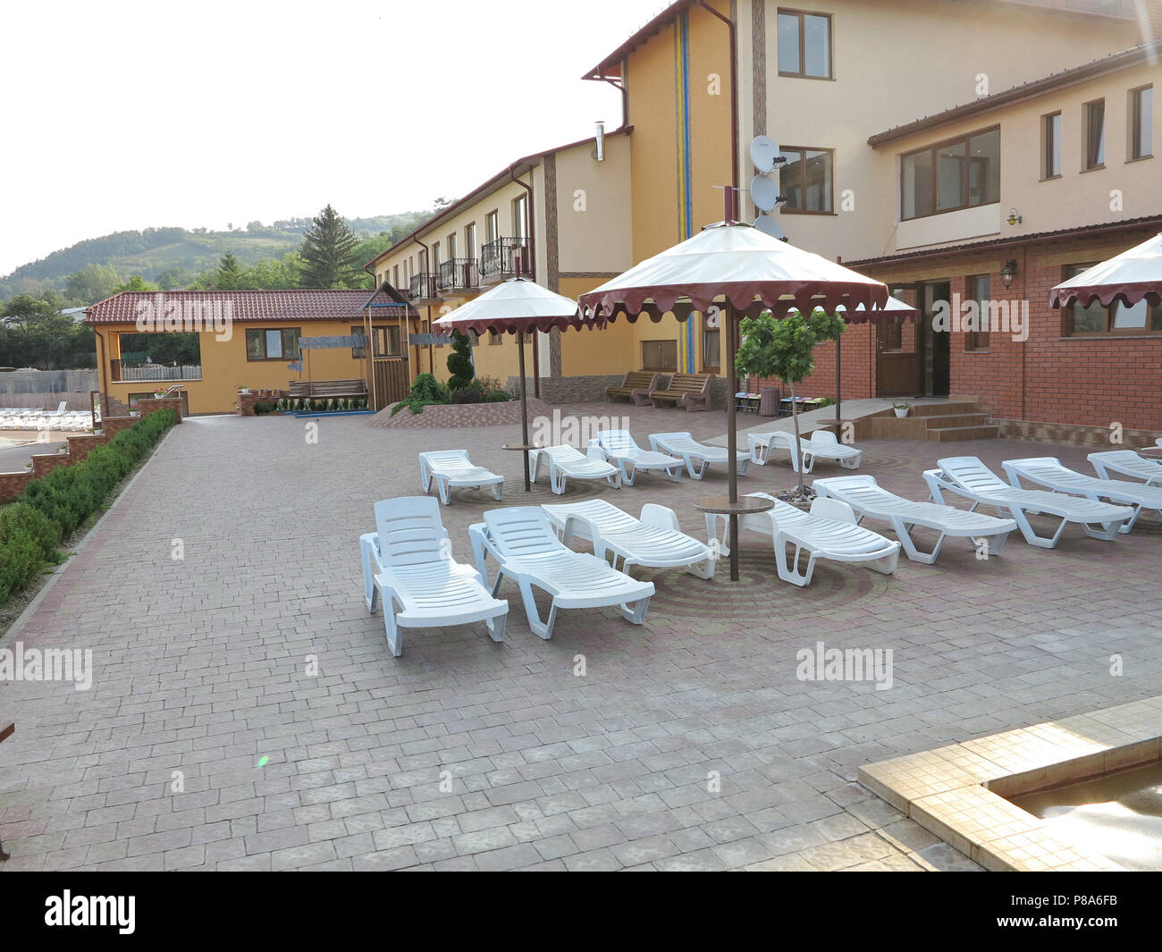 base for recreation with modern buildings and a patio with furniture ...