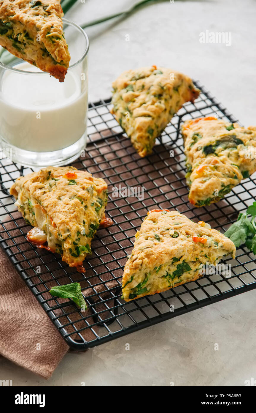 Savory scones with feta mozzarella and green herbs on a wire rack Stock ...