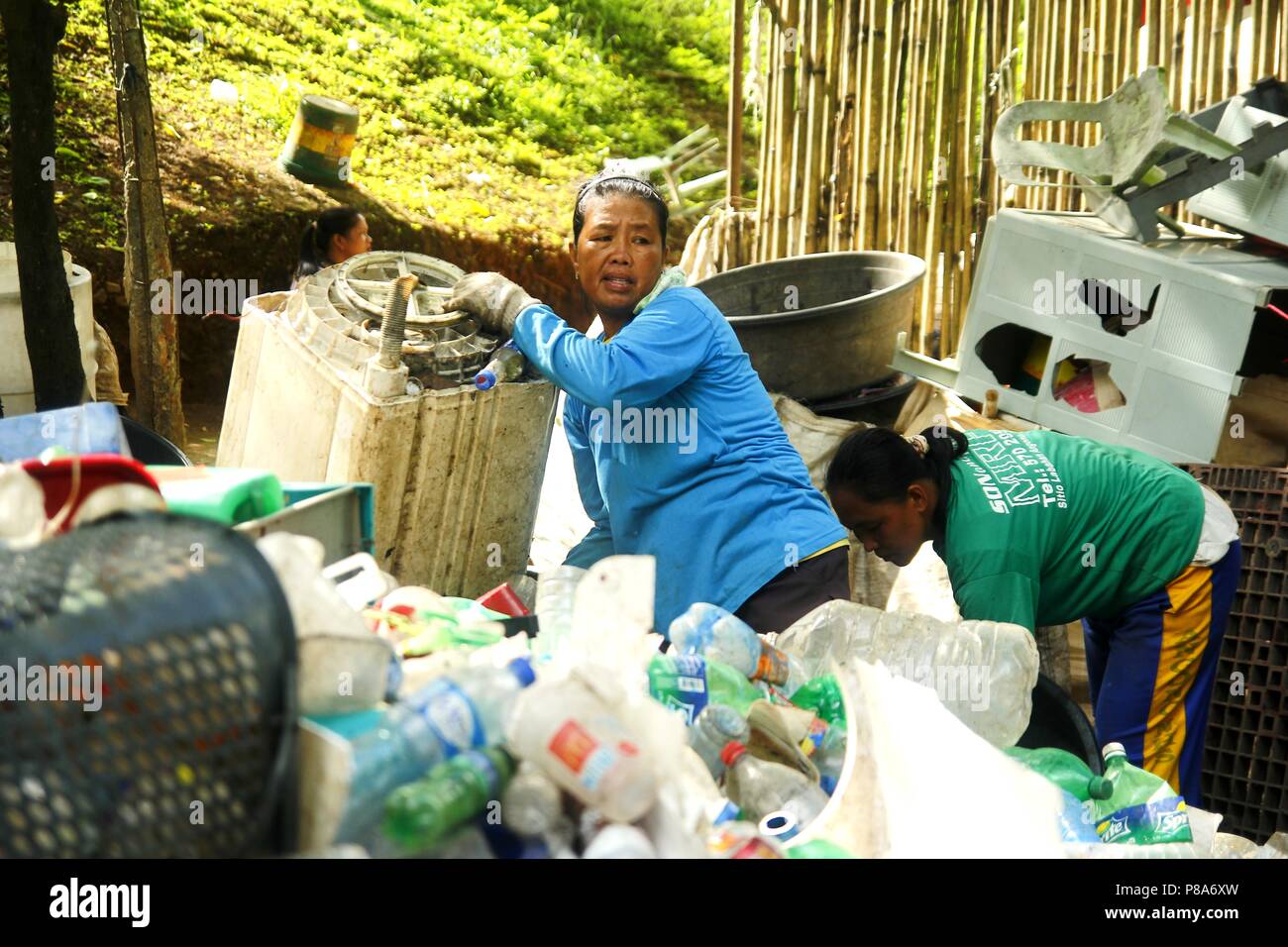 ANGONO, RIZAL, PHILIPPINES - JULY 4 2018: Workers of a materials ...