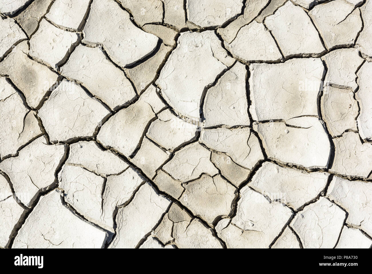 Overhead view of the patterns of a cracked dry grey earth Stock Photo ...