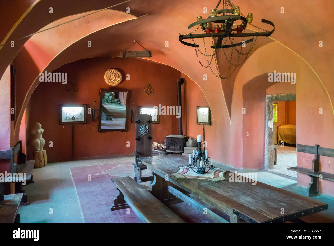 Museum exposition of a medieval room with a long dining table, high ...