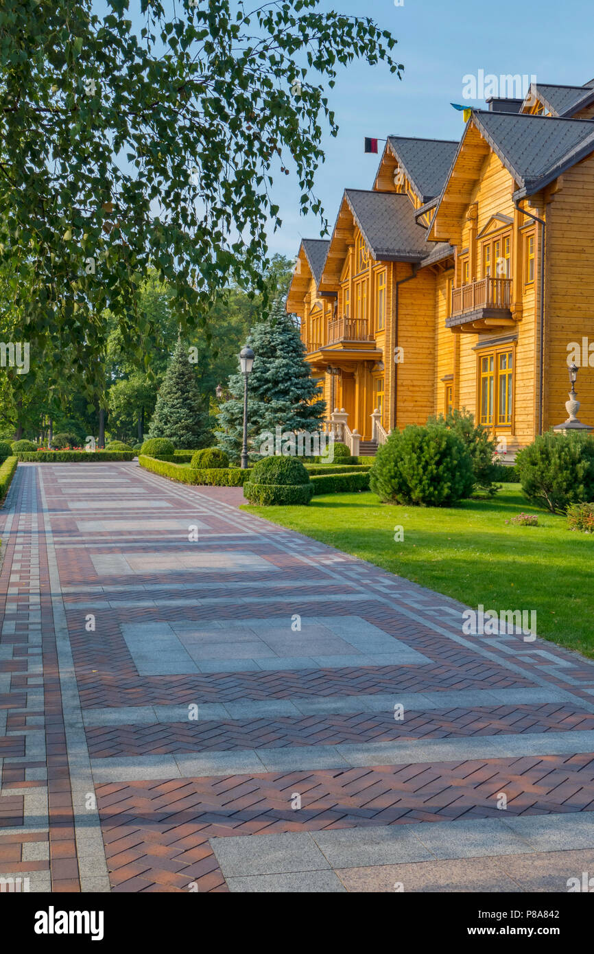 The path in the park is laid out of tiles in the form of squares ...